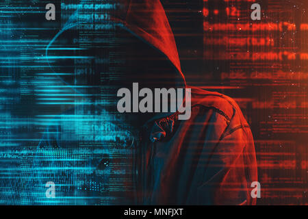 Stereotypical image of computer hacker with hoodie and computer code ...