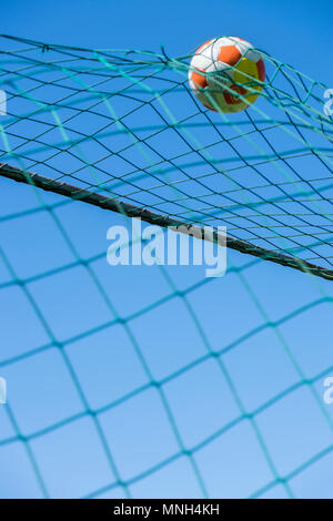 Football hitting the back of a goal net Stock Photo - Alamy