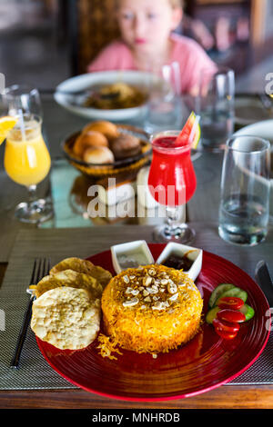 Fresh prepared malaysian fried rice with vegetables on local market on ...
