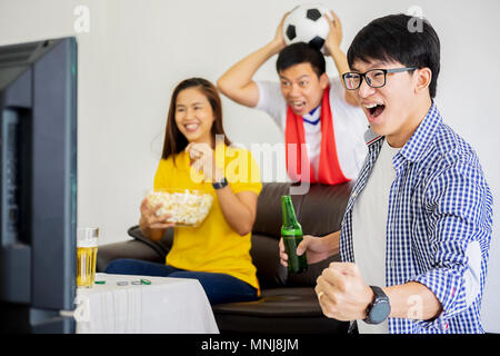Fans watch a Champion league soccer match between Arsenal and Paris ...