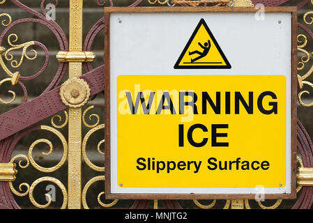 Warning ice slippery surface sign black text on yellow and white ...