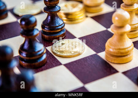 Golden bitcoin coins symbolizes elements of crypto currency with chess ...