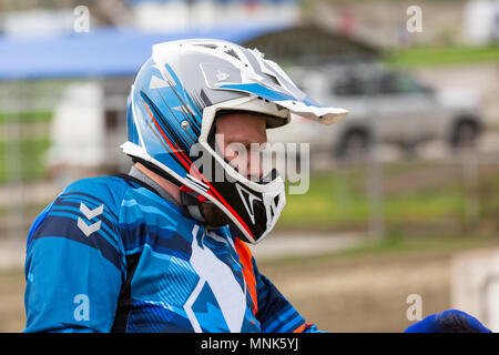 Handsome rider man in black leather biker jacket look to his classic ...