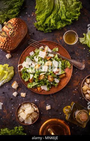 Plate with Caesar salad on color background, closeup Stock Photo - Alamy