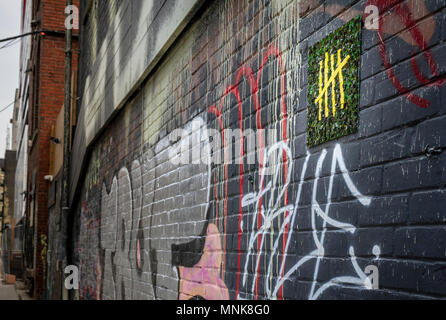 Mosaic graffiti by street artist Mark Tally displayed on the walls of ...