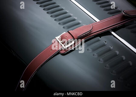 Classic car leather bonnet strap Stock Photo - Alamy
