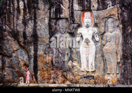 Female tourist visiting Buduruwagala temple with well preserved ...