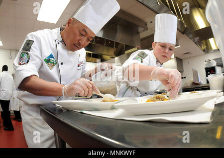 Competitors put the final touches on their piece for the ice sculpture ...