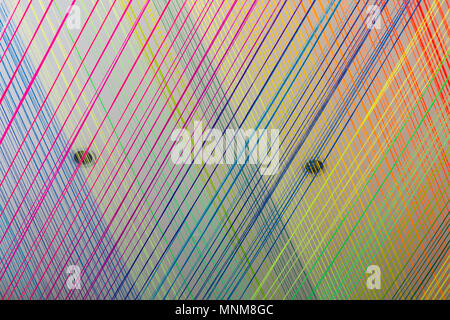 Lines of colourful wool strings as an artistic display Stock Photo - Alamy