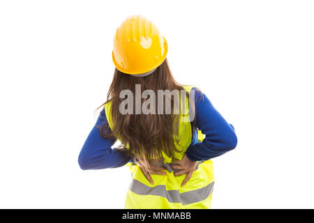 Rear view of young contractor or architect using tablet in studio with ...