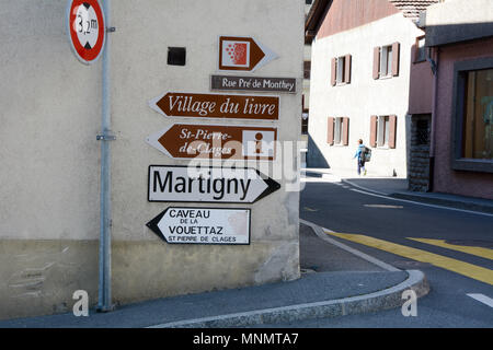Road signs on a street corner in the market town of Market Harborough ...