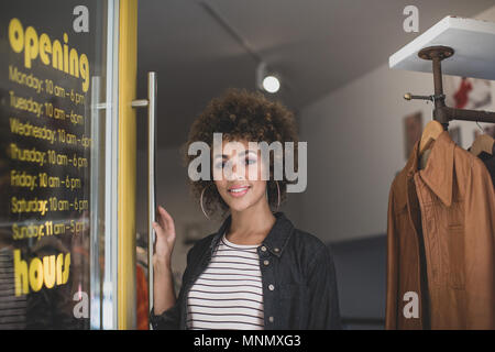 Portrait of a store manager in clothing store Stock Photo - Alamy