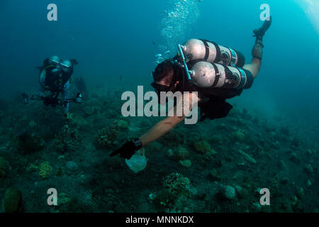 Navy Diver 1st Class Jesse Stigibauer, assigned to the Naval Base Guam ...