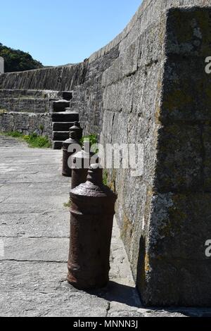 The Harbour and sea wall defences at Port-en-Bessin, Normandie Stock ...