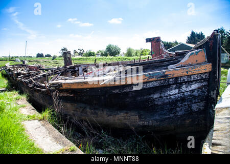 Wooden ship skeleton. Rotting hull of a substantial wooden boat. Rivets ...