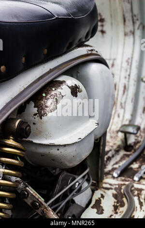A very old scooter in very poor condition in need of a full restoration ...