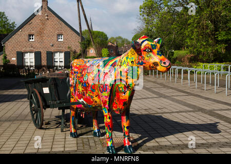 Colourfully painted cow statue in front of the Parkhotel, Schlangenbad ...