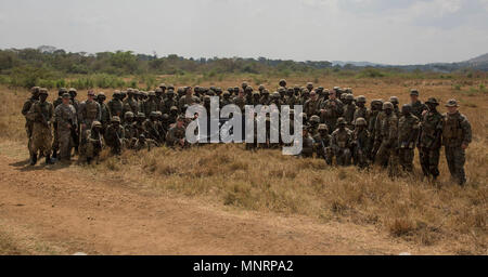 Uganda Peoples' Defence Force soldiers practice ground maneuvers during ...