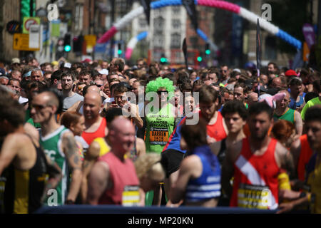 Naked disabled female in green body paint in crowd participating in ...