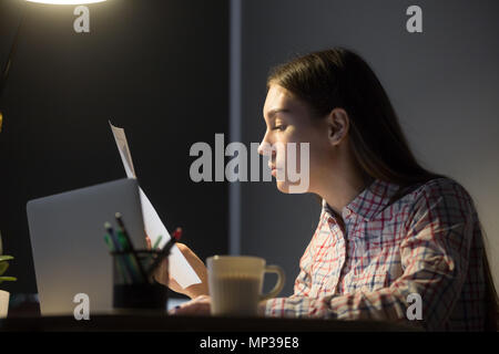 Business professional analyzing financial reports, reviewing ...