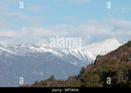 Snow and iced covered Himalayan mountains, seen from a hike near Paro ...