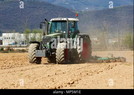 Castegnato (Bs), Franciacorta,Italy, the plowing of a field of wheat ...