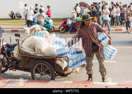 A man delivers plastic bottles of water during a hot day in Istanbul ...