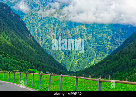 Roadway in Lauterbrunnen valley with Bernese Alps mountains in ...