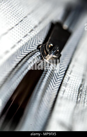 grey coloured open zipper Stock Photo - Alamy