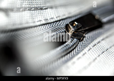 grey coloured open zipper Stock Photo - Alamy