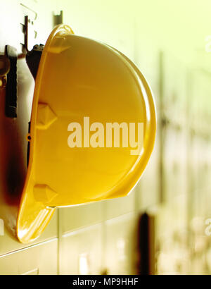 Safety helmet hanging on locker for worker equipment Stock Photo - Alamy