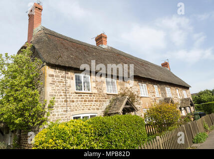 Historic thatched cottages at village of Sandy Lane, Wiltshire, England ...
