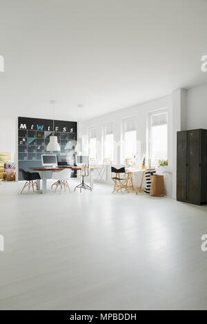 Bright office workspace. Work space with notepad, keyboard, coffee and ...