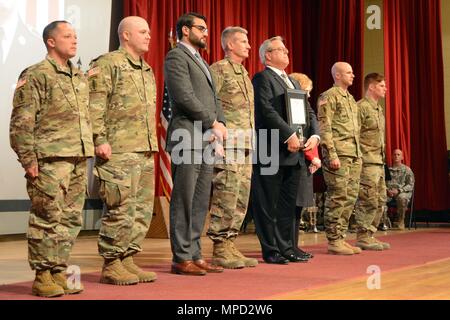 Army Lt. Gen. John Nicholson Jr., right, gets a kiss from his wife ...