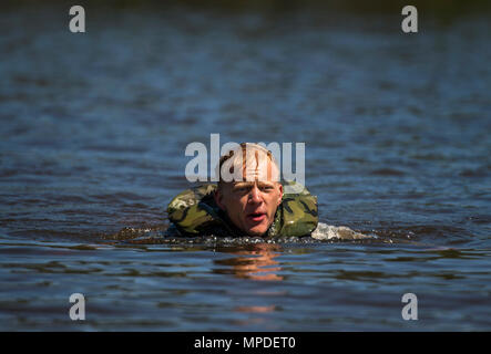 A U.S. Army Ranger swims in Victory Pond during the Best Ranger ...
