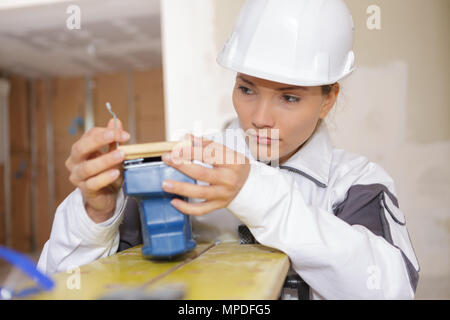 female construction fixing sanding machine Stock Photo - Alamy