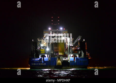 The USNS Vice Adm. K. R. Wheeler sits in position over the pipeline ...