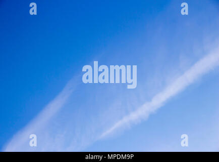 Clear blue sky with rare blurry white clouds Stock Photo - Alamy