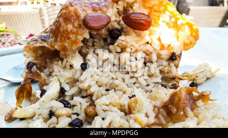 Turkish Perde Pilavi. Drape pilaf with chicken, almond and raisin. A ...