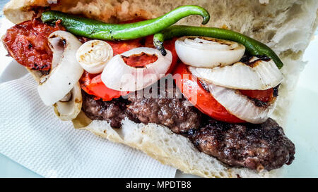 Meatball Sandwich with tomatoes, onion and green pepper on rustic ...