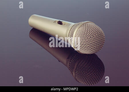 Studio microphone lying on the table close-up Stock Photo - Alamy
