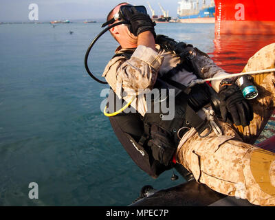 US Navy EOD personnel conduct checks on their equipment before ...