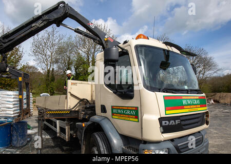 A Huws Gray builders merchant lorry delivering building products Stock ...