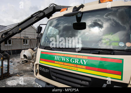 A Huws Gray builders merchant lorry delivering building products Stock ...