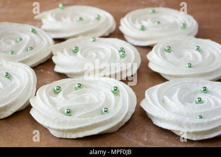 French vanilla meringue cookies on white background with copy space ...