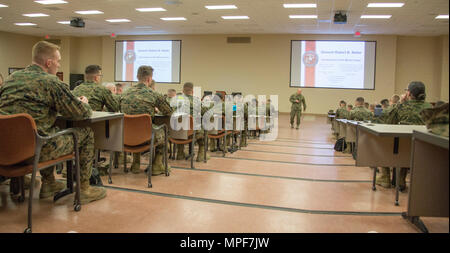 U.S. Marines with The Basic School (TBS) take off from the start line ...
