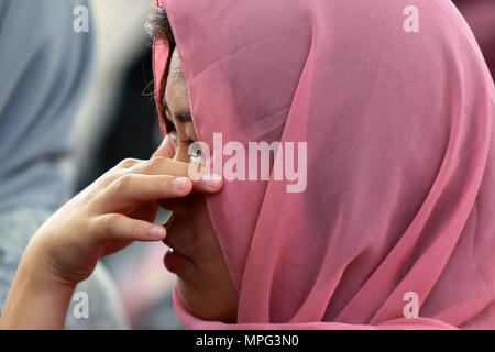 Marawi City, Philippines. 23rd May, 2018. A woman cries during the ...