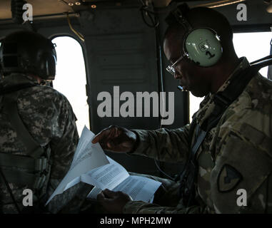 Chief Warrant Officer 5 Darren Cook and Capt. Joseph Koennecke discuss ...