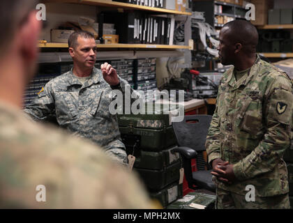 Chief Warrant Officer 5 Darren Cook and Capt. Joseph Koennecke discuss ...