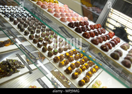 Shop counter with luxurious hand made chocolates in a variety of ...